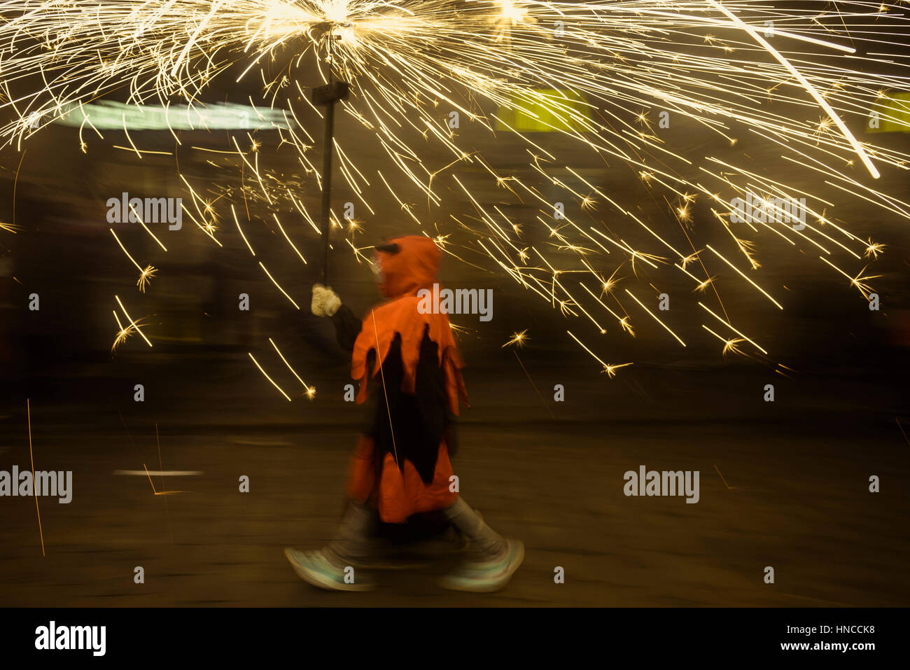 Barcelona, Spain. 11th Feb, 2017. A child in a devil costume dances to ...