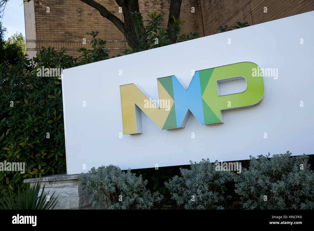 A logo sign outside of a facility occupied by NXP Semiconductors in ...