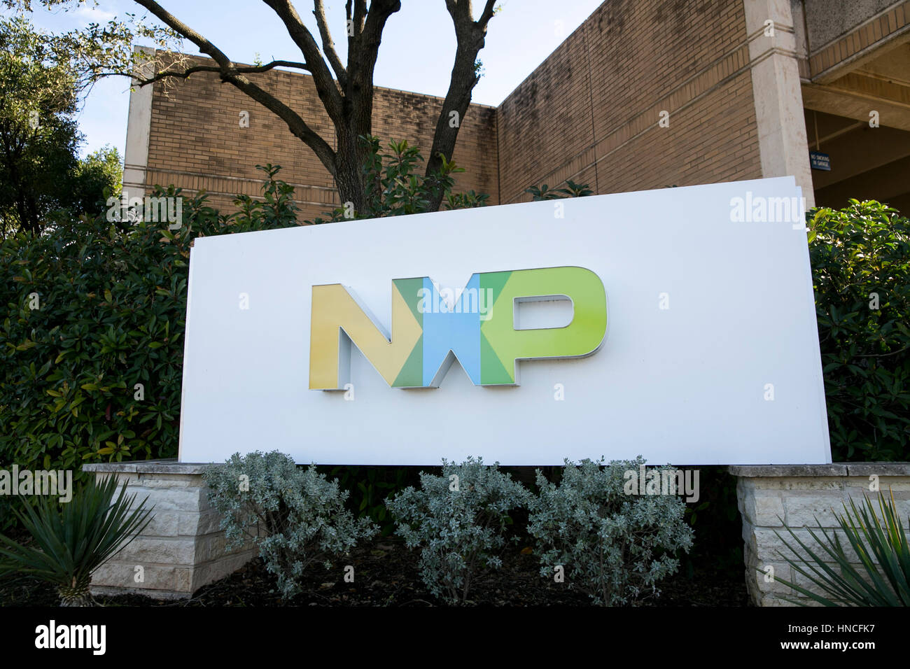 A logo sign outside of a facility occupied by NXP Semiconductors in ...