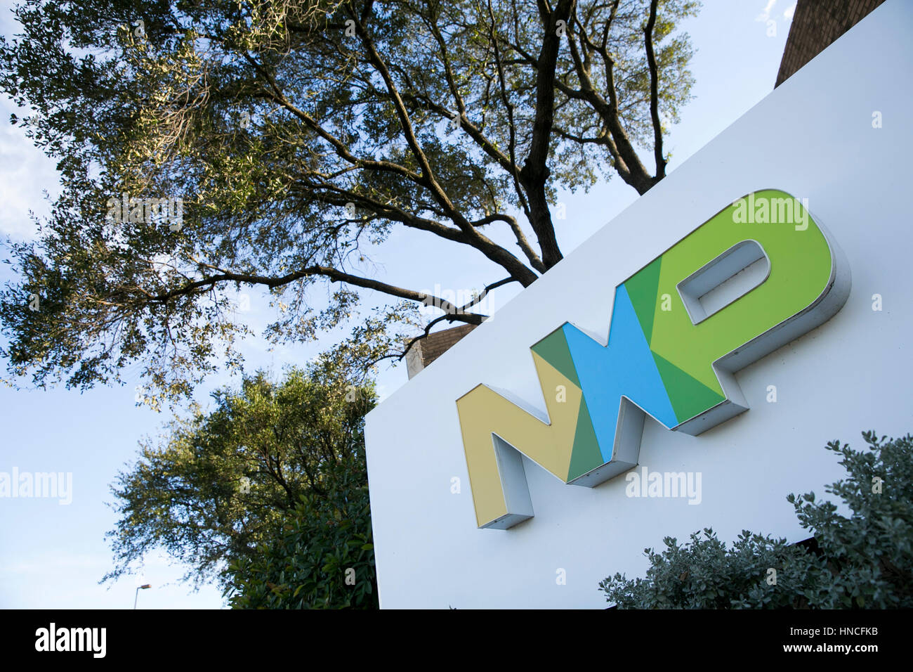 A logo sign outside of a facility occupied by NXP Semiconductors in ...
