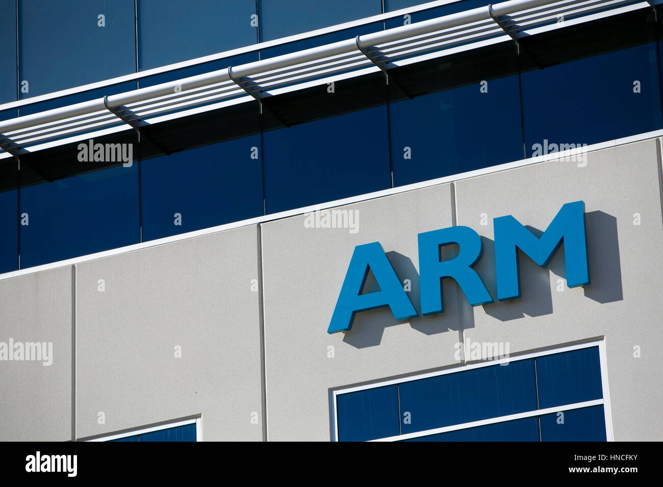 A logo sign outside of a facility occupied by ARM Holdings in Austin ...