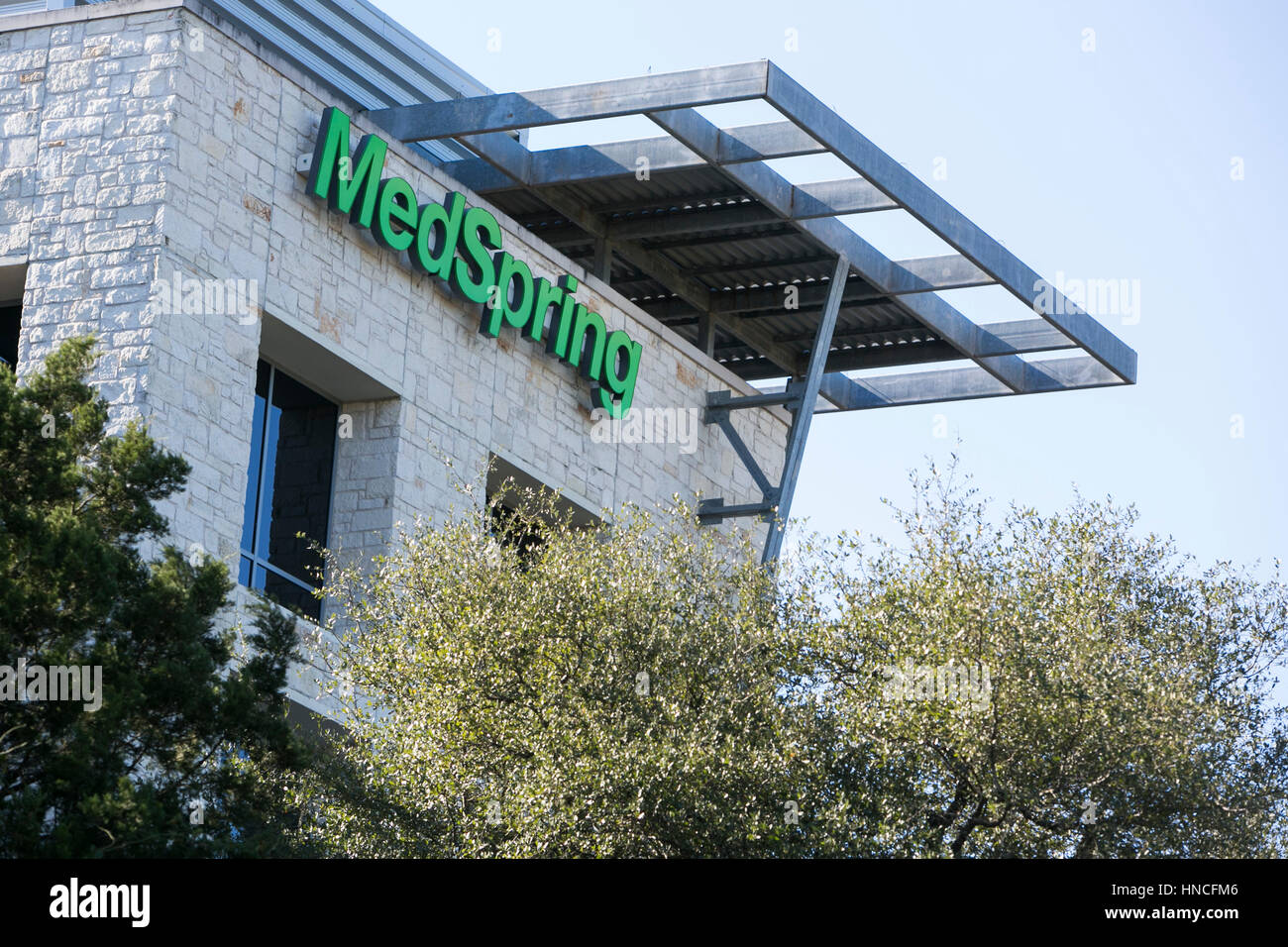 A logo sign outside of the headquarters of MedSpring in Austin, Texas ...