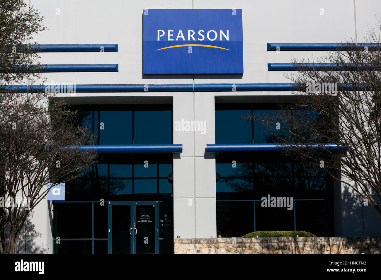 A logo sign outside of a facility occupied by Pearson PLC in Austin ...