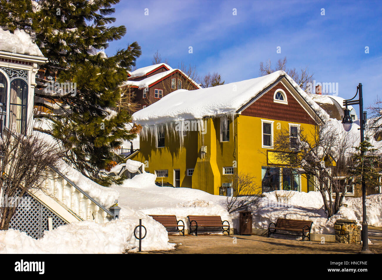 Building With Snow & Icycles On Roof Stock Photo - Alamy