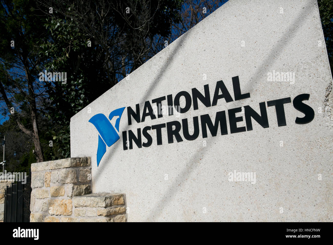 A logo sign outside of the headquarters of the National Instruments ...