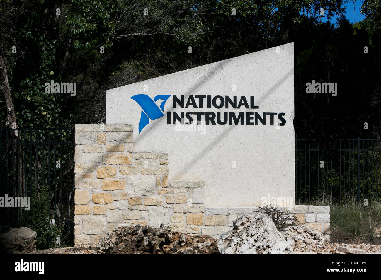 A logo sign outside of the headquarters of the National Instruments ...