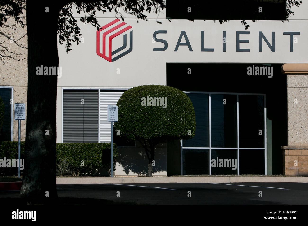 A logo sign outside of a facility occupied by Salient Systems in Austin ...