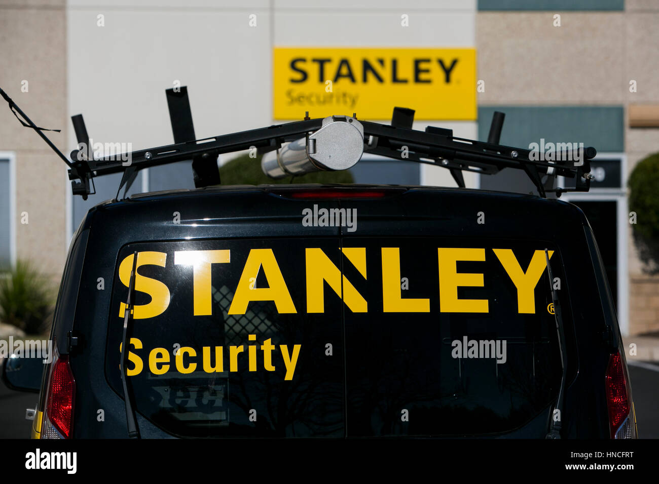 A logo sign outside of a facility occupied by Stanley Security in ...
