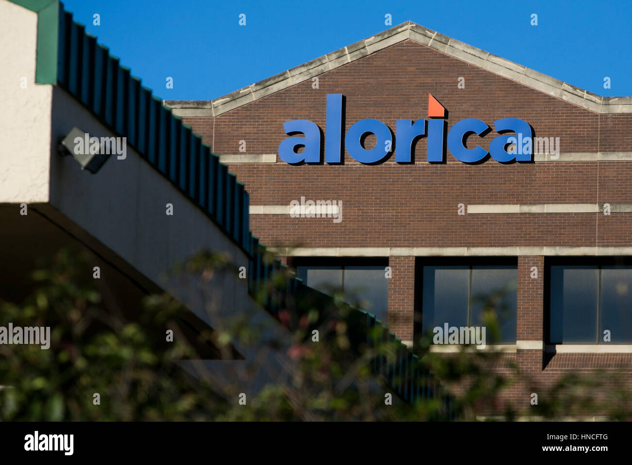 A logo sign outside of a facility occupied by Alorica in San Antonio ...