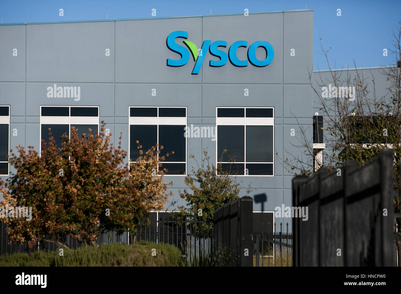A logo sign outside of a facility occupied by the Sysco Corporation in ...