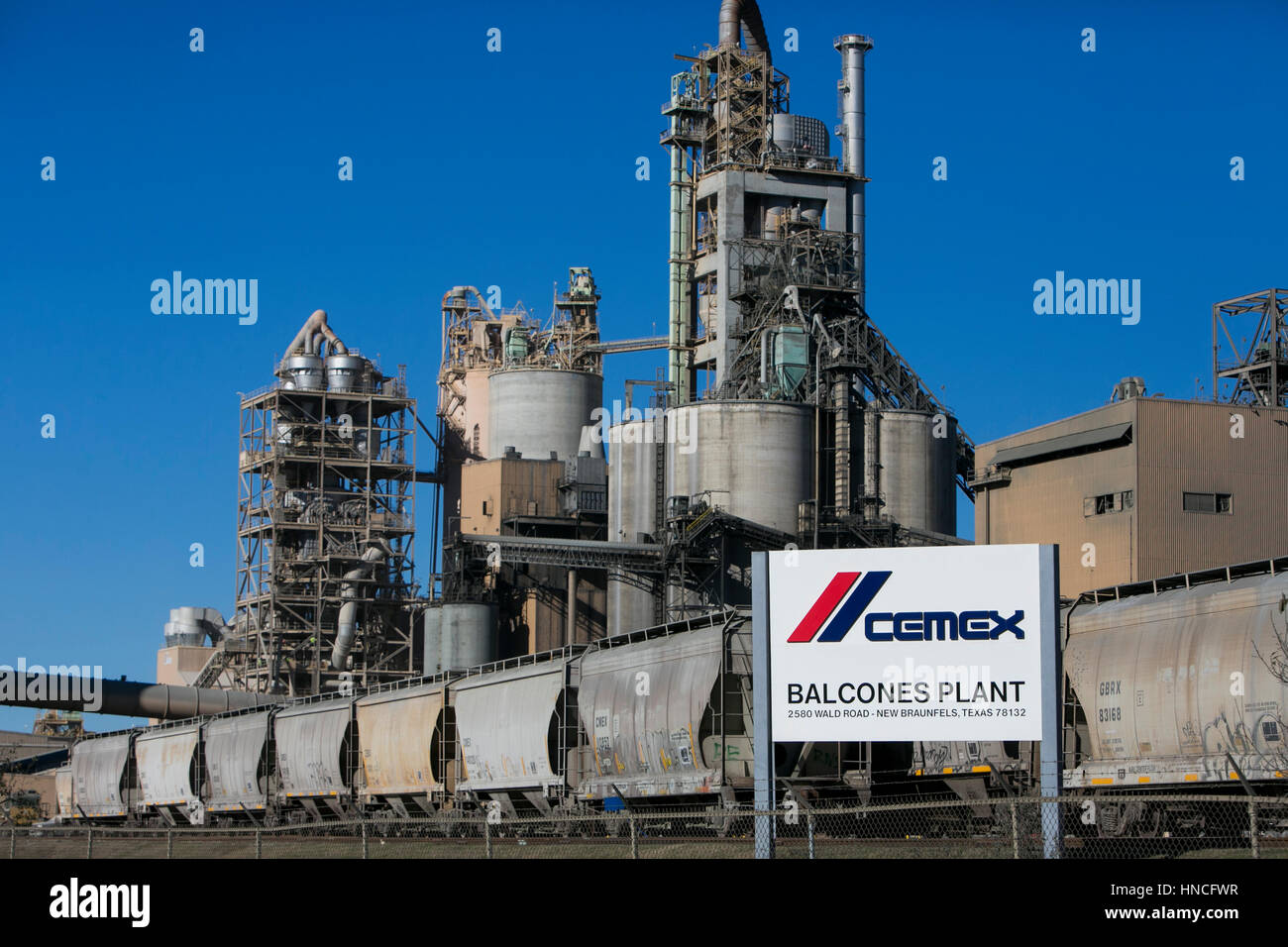 A logo sign outside of a facility occupied by Cemex in New Braunfels ...