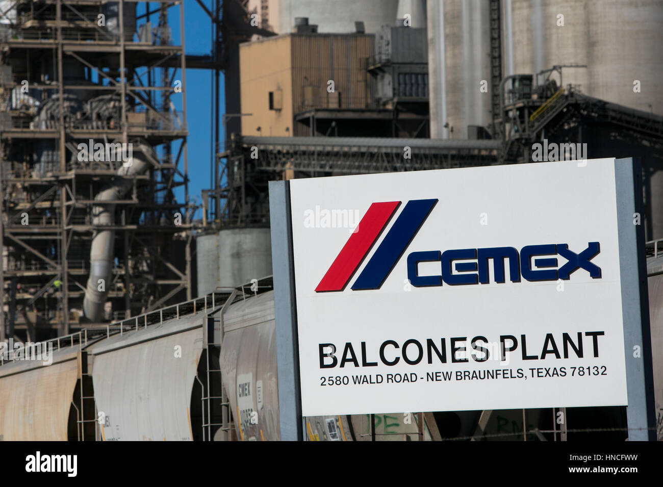 A logo sign outside of a facility occupied by Cemex in New Braunfels ...