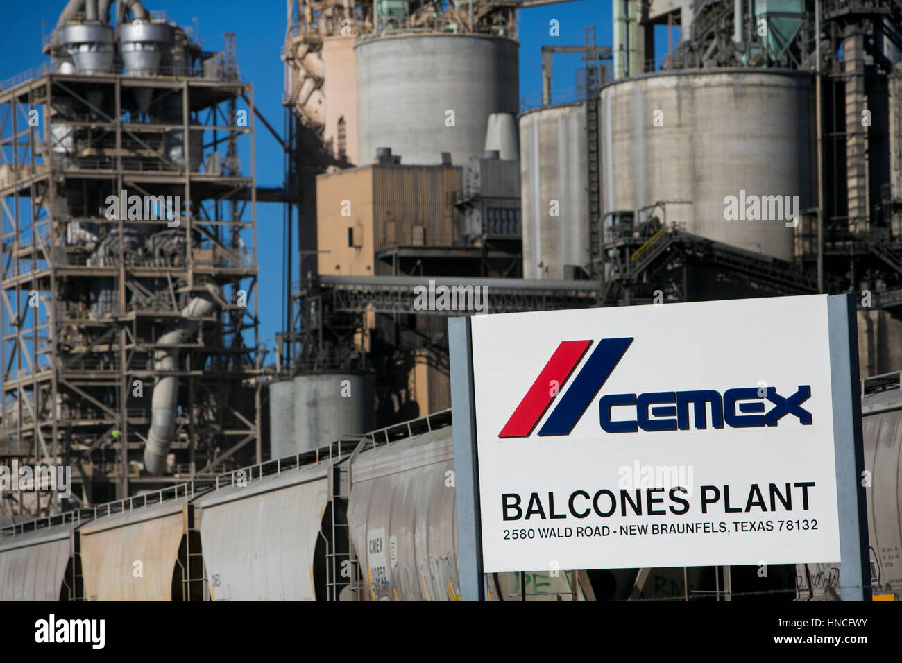A logo sign outside of a facility occupied by Cemex in New Braunfels ...