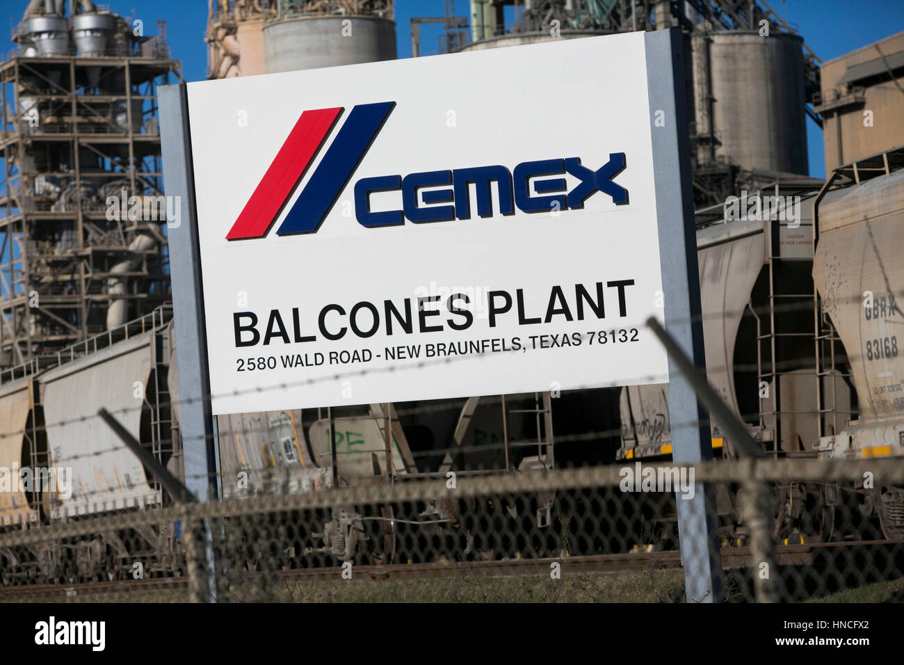 A logo sign outside of a facility occupied by Cemex in New Braunfels ...