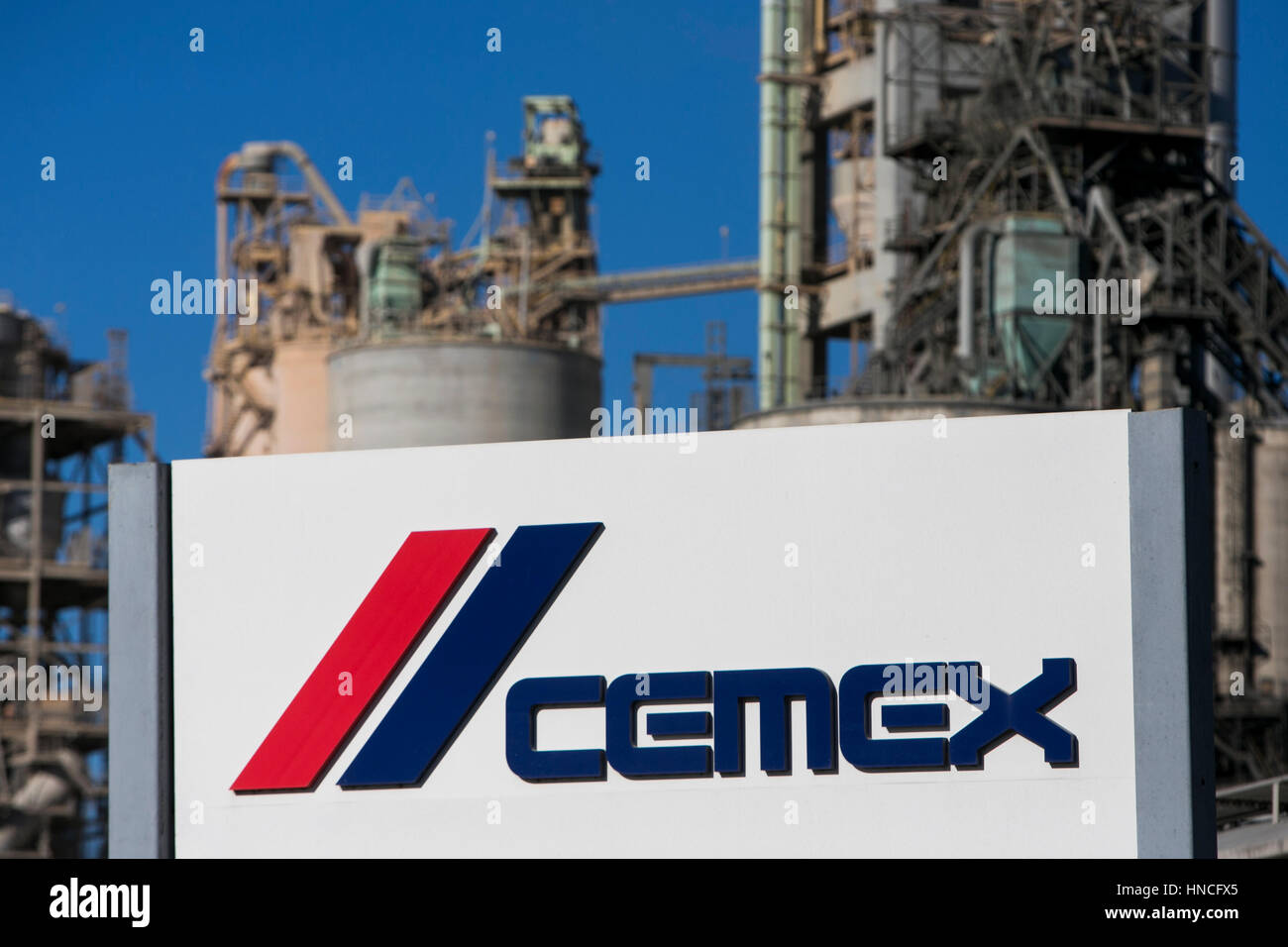 A logo sign outside of a facility occupied by Cemex in New Braunfels ...