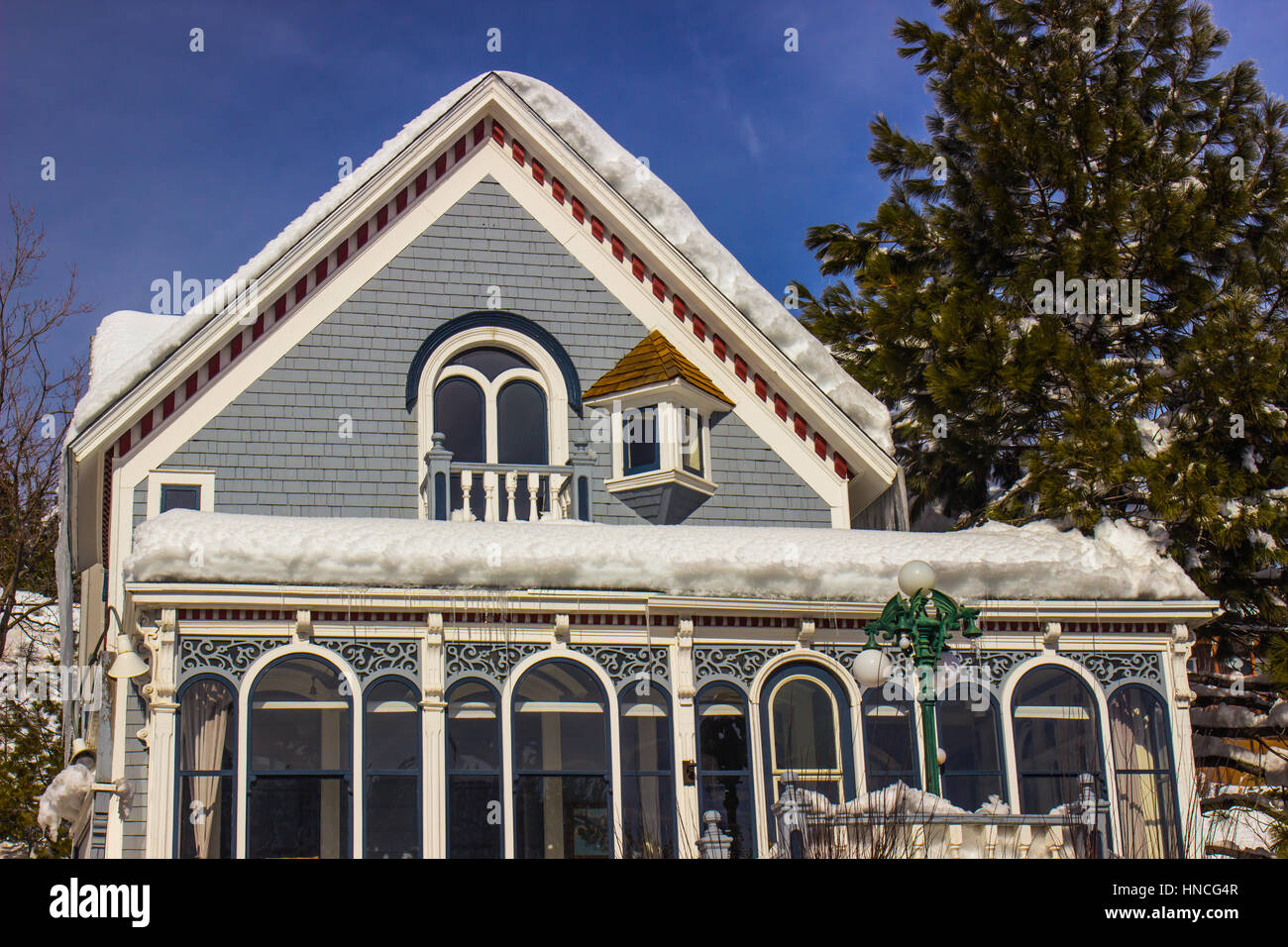 Snow On Roof Of Old House Stock Photo - Alamy