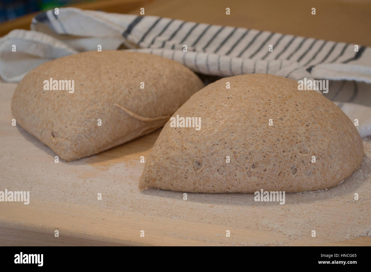Risen Dough Cut into Two Halves Stock Photo - Alamy