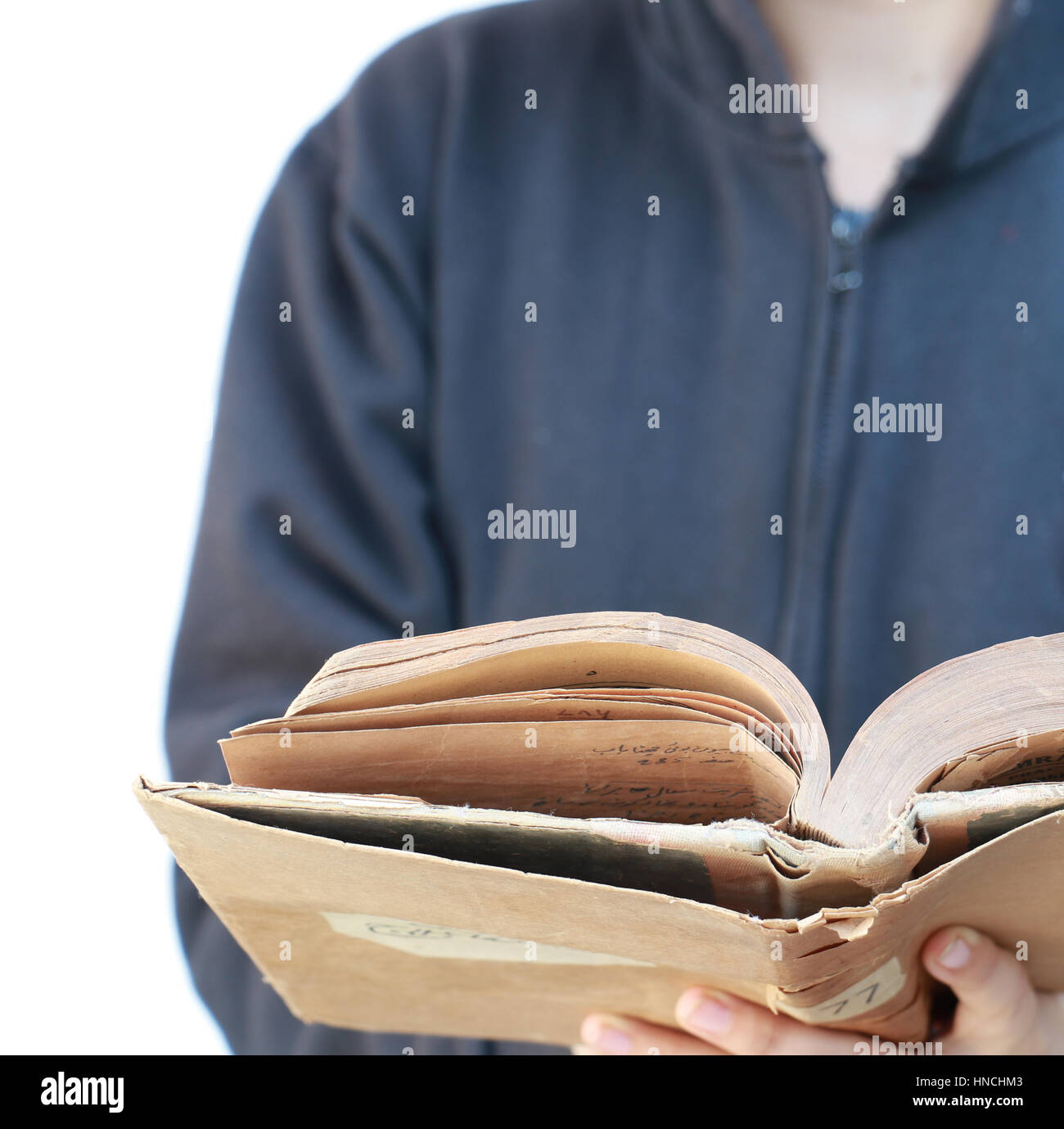Human hand holding open book hi-res stock photography and images - Alamy