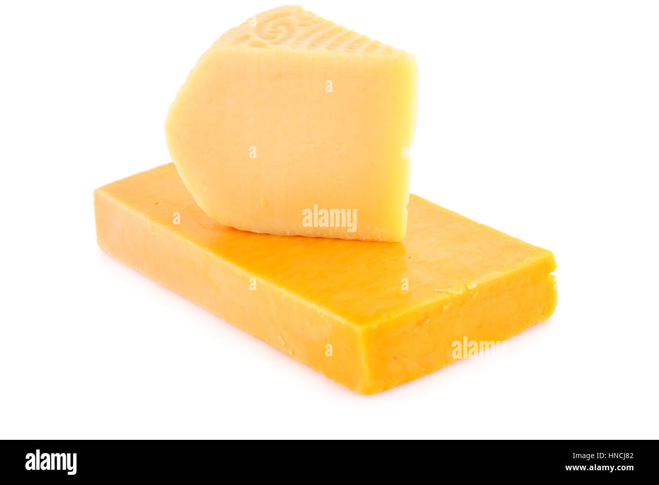 Two pieces of cheese isolated on white background Stock Photo - Alamy