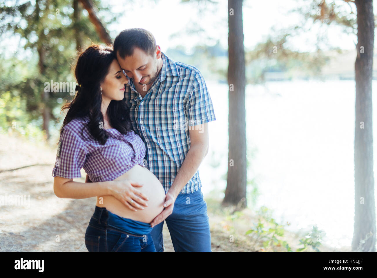 Happy family is waiting their baby Stock Photo - Alamy