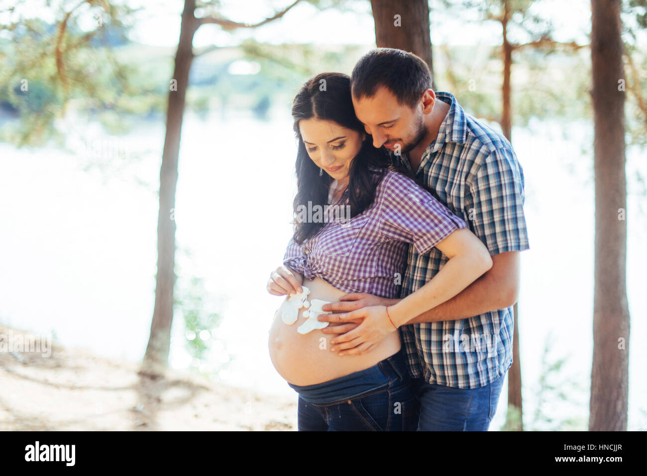 Happy family is waiting their baby Stock Photo - Alamy