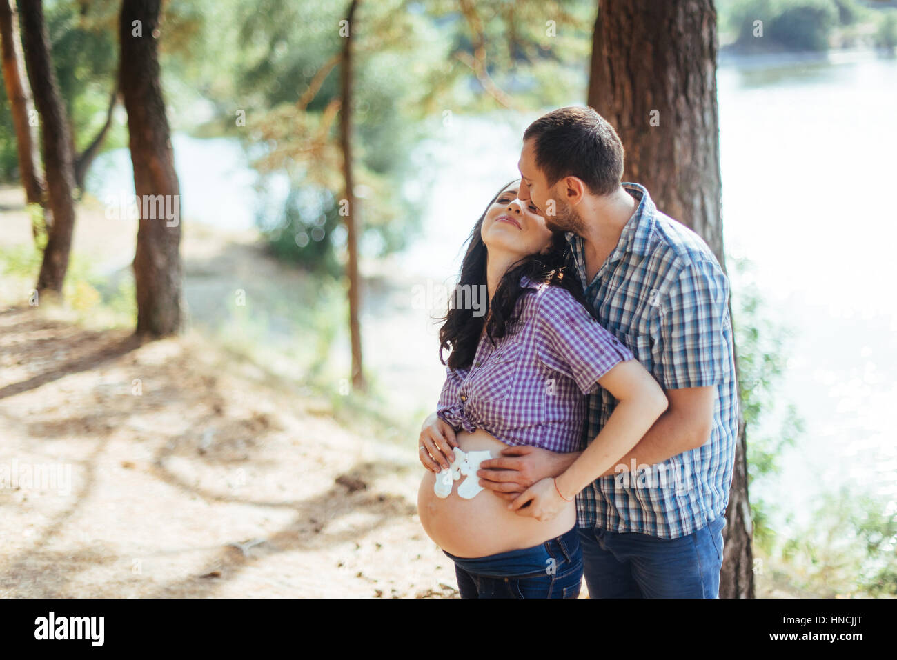 Happy family is waiting their baby Stock Photo - Alamy
