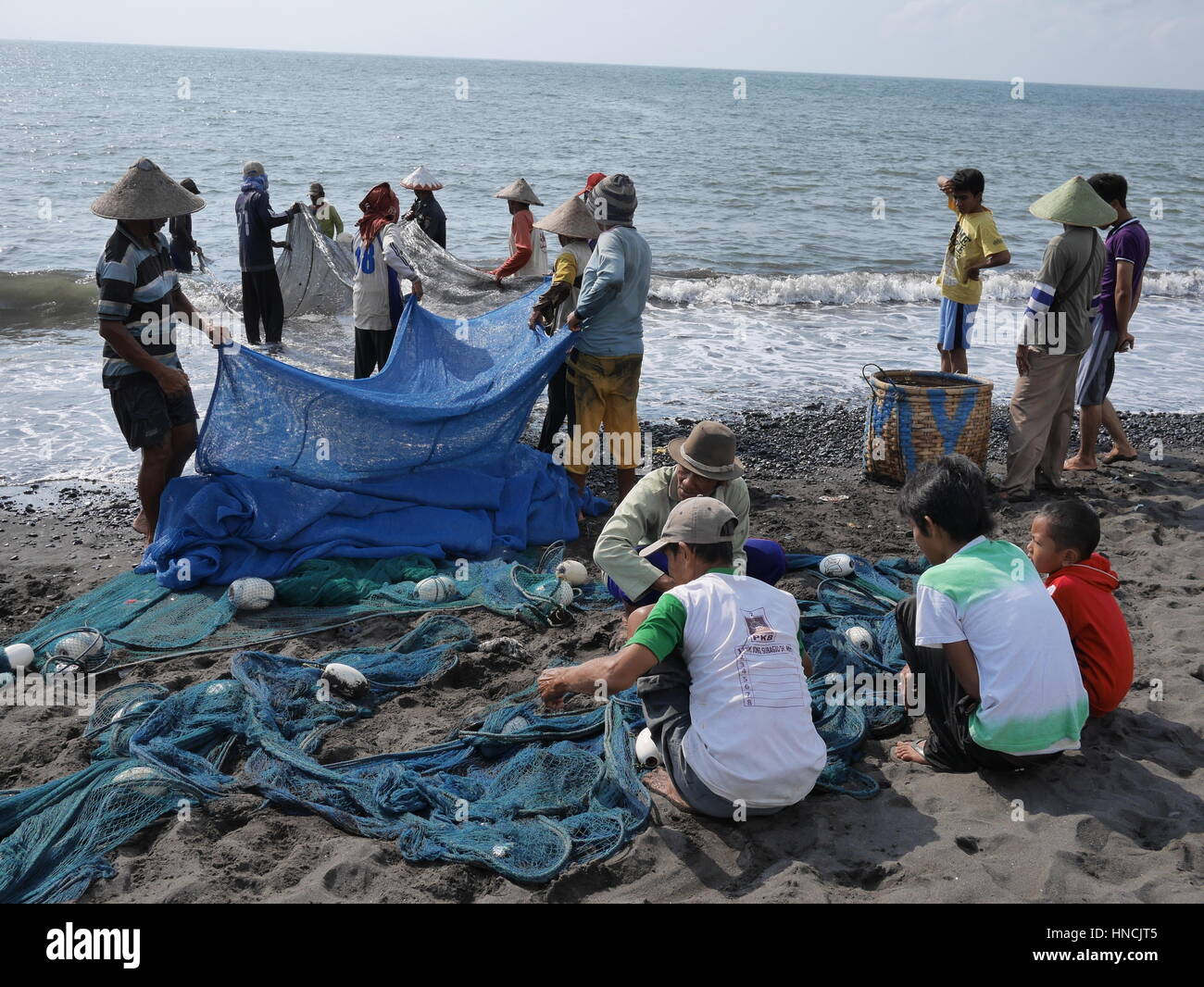 Indonesia, East Java, Banyuwangi, Cemara beach. Fisherman activities in ...