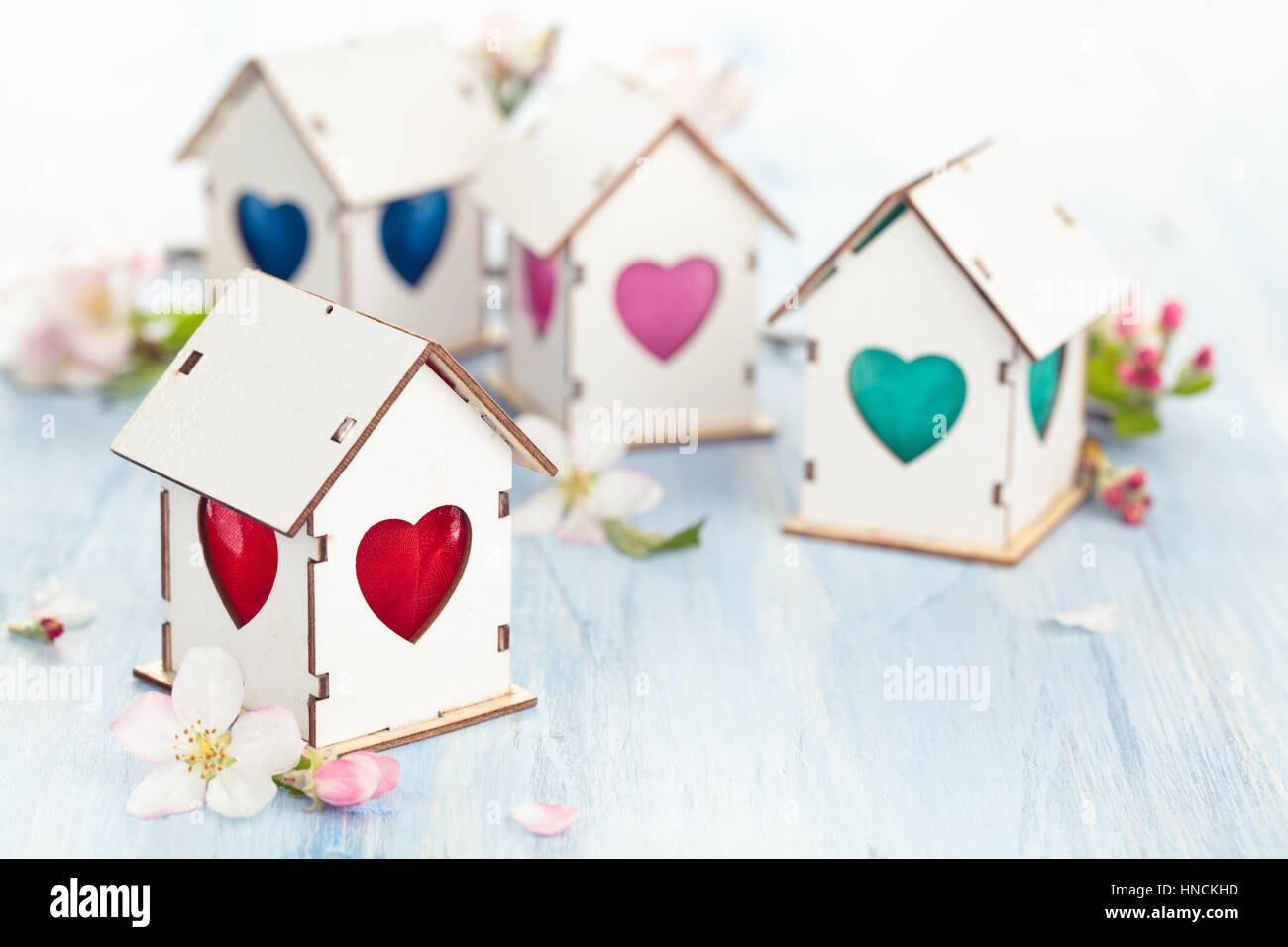 White wooden houses with colorful heart shaped windows Stock Photo - Alamy