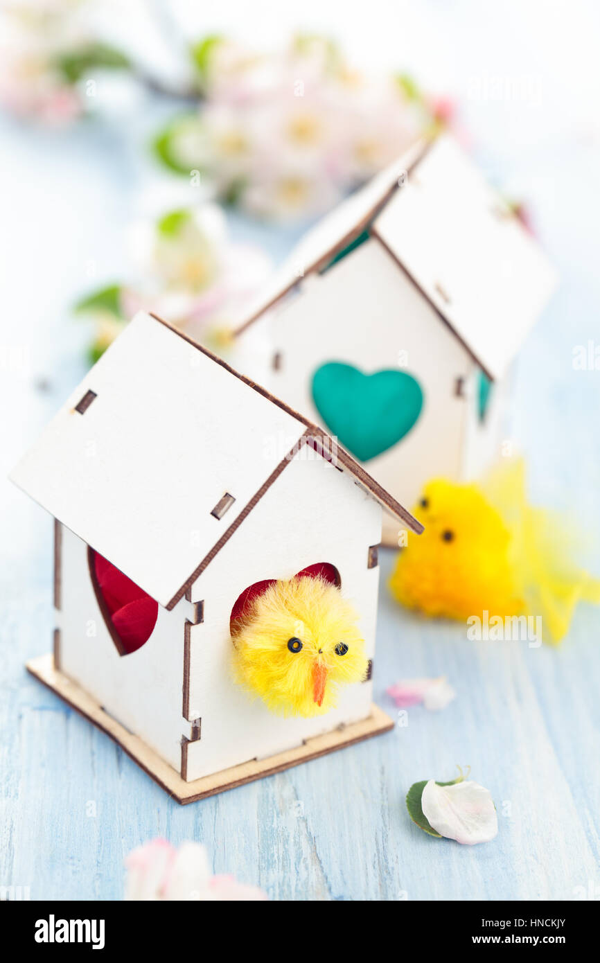 White Wood houses with colorful heart shaped windows Stock Photo - Alamy