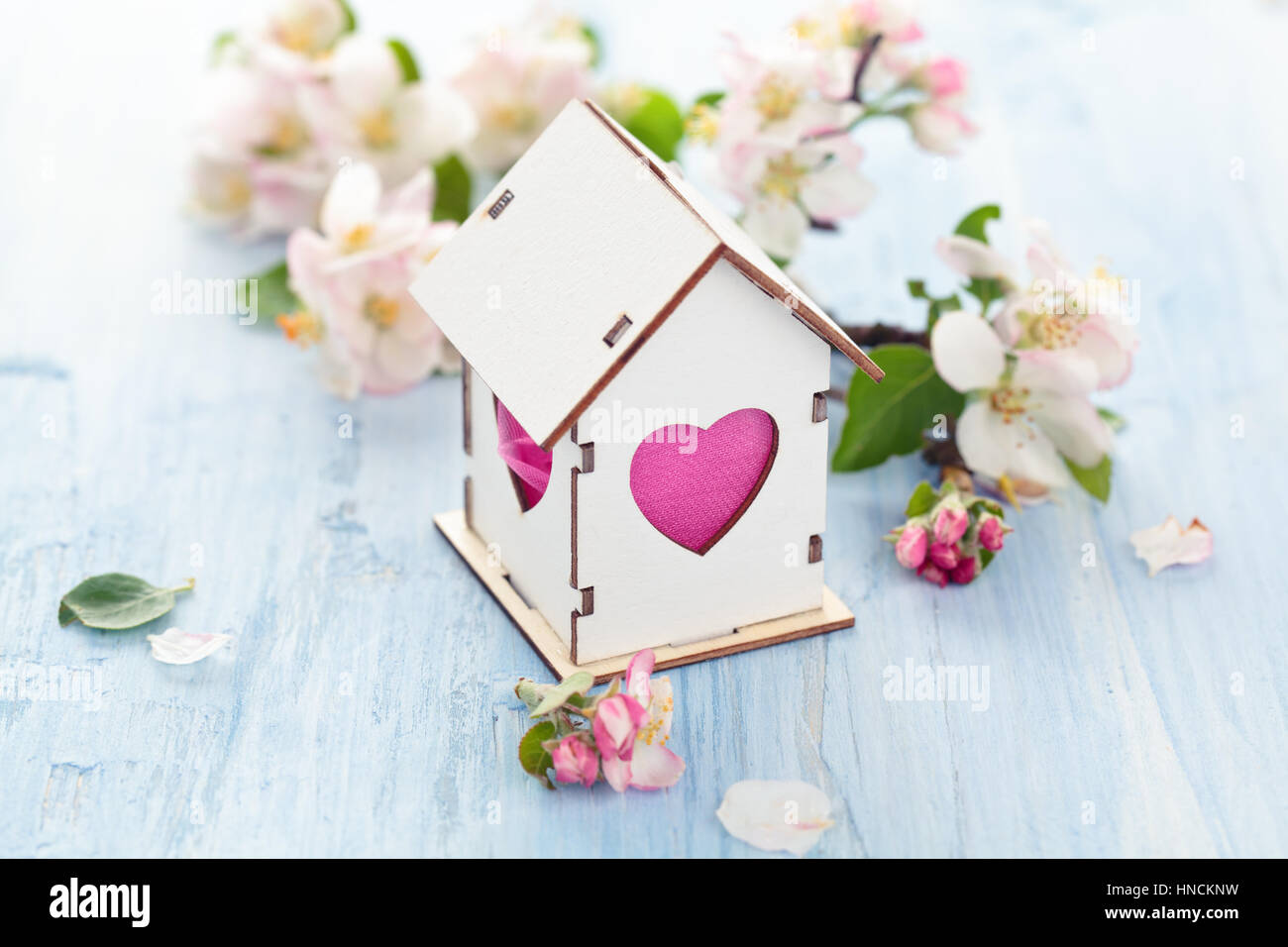 White Wood houses with colorful heart shaped windows Stock Photo - Alamy