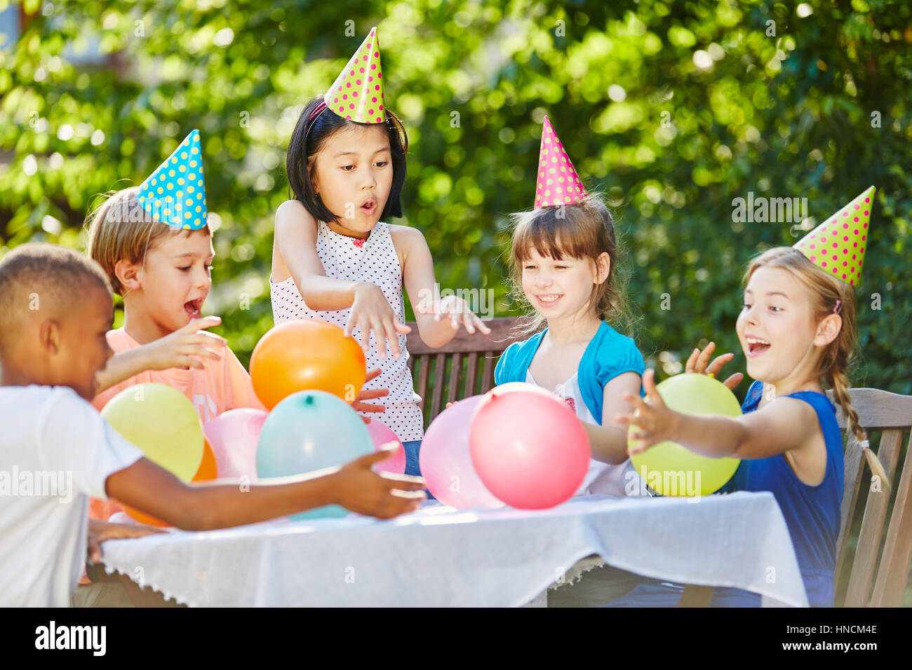 Kids have fun at childrens birthday party in summer in garden Stock ...