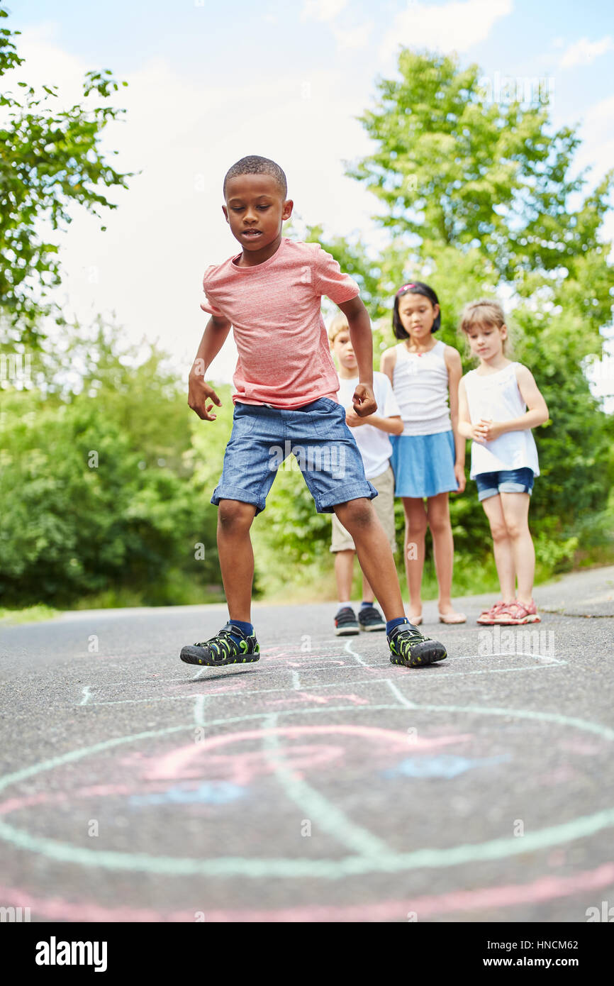 Kids playing hopscotch hi-res stock photography and images - Alamy