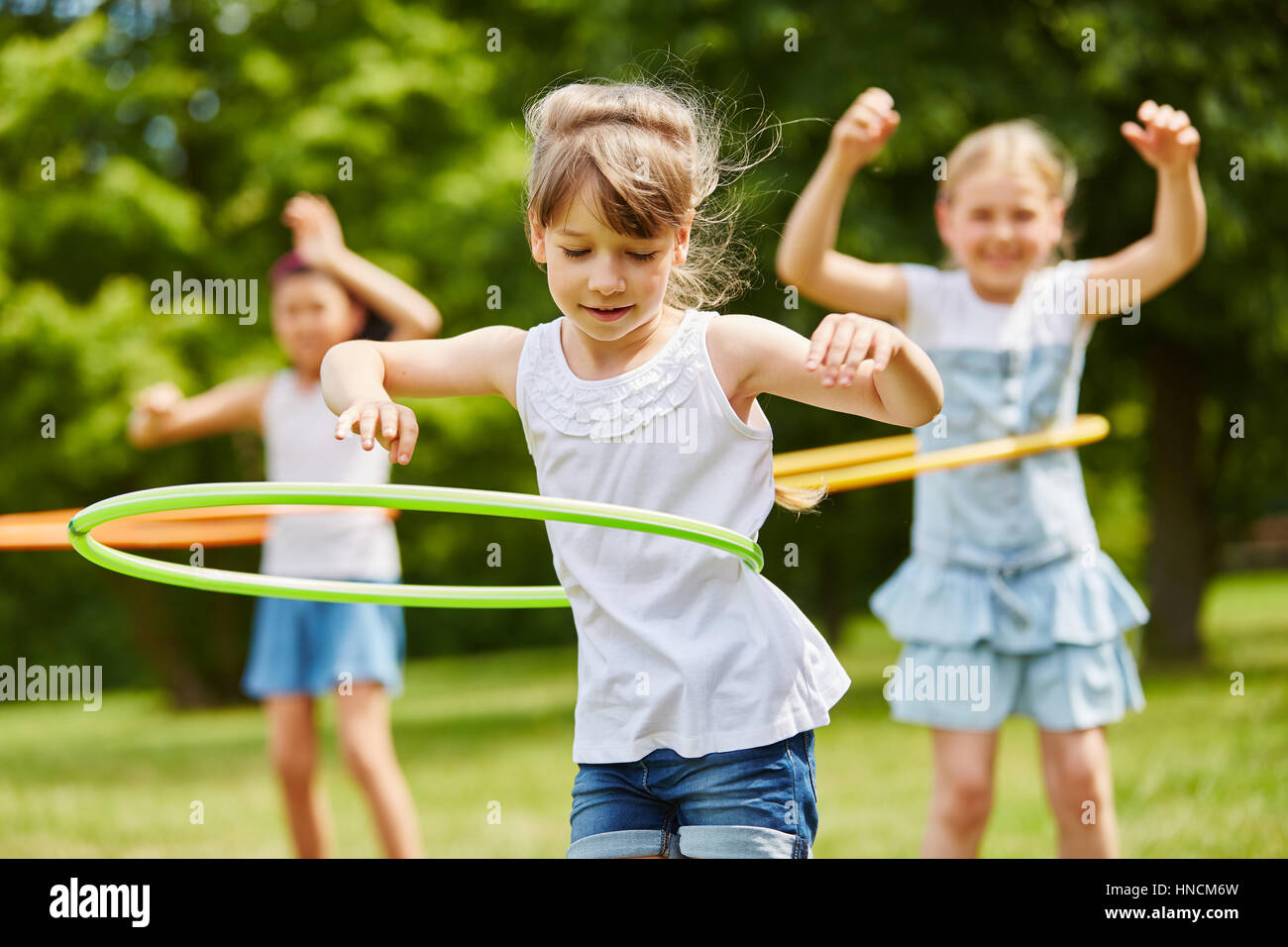 Children training their movement skills in the park Stock Photo - Alamy
