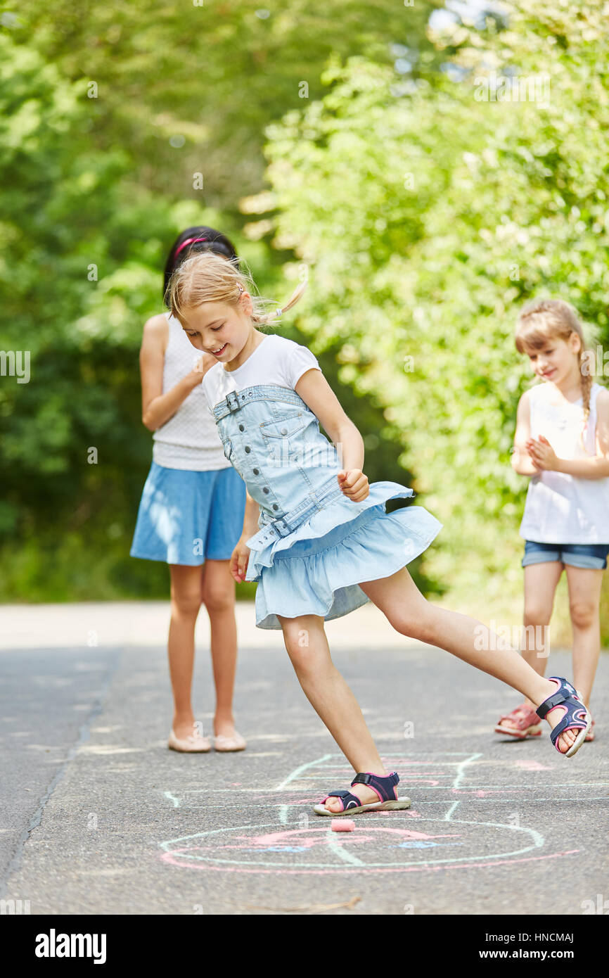 Kids playing hopscotch hi-res stock photography and images - Alamy