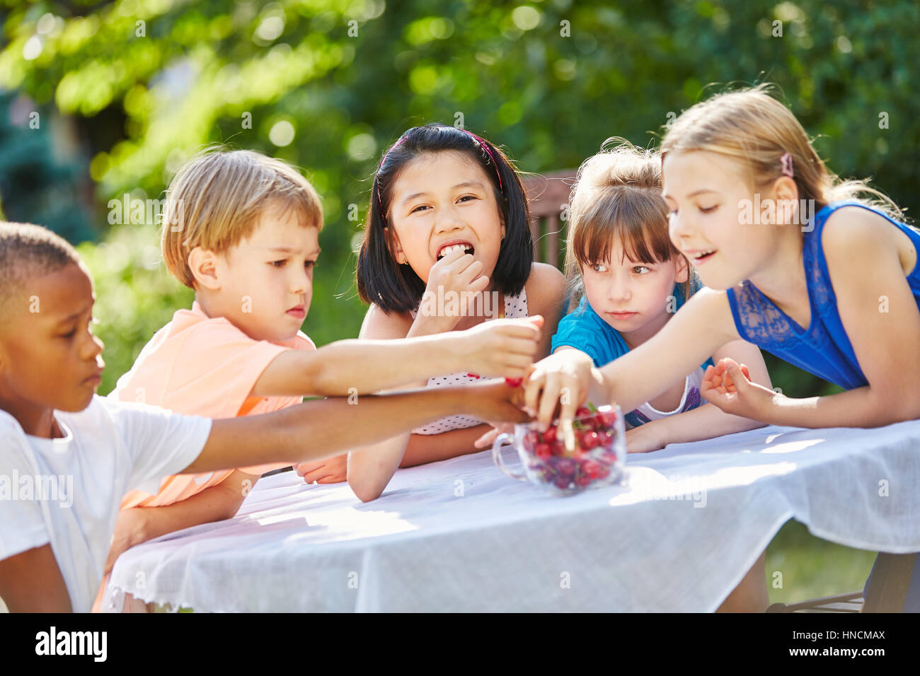 Children eating cherries hi-res stock photography and images - Alamy