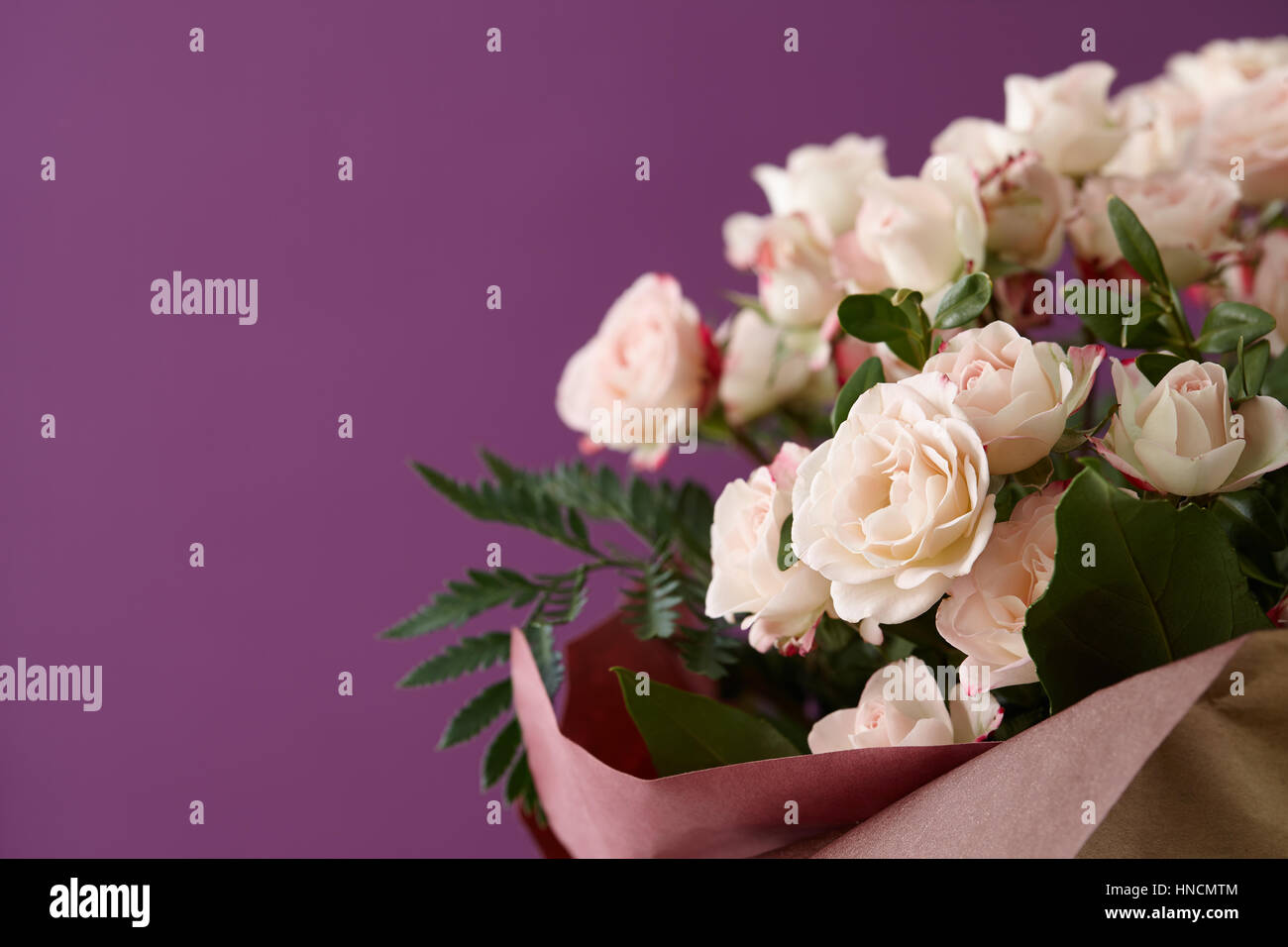 Purple roses bouquet Stock Photo - Alamy