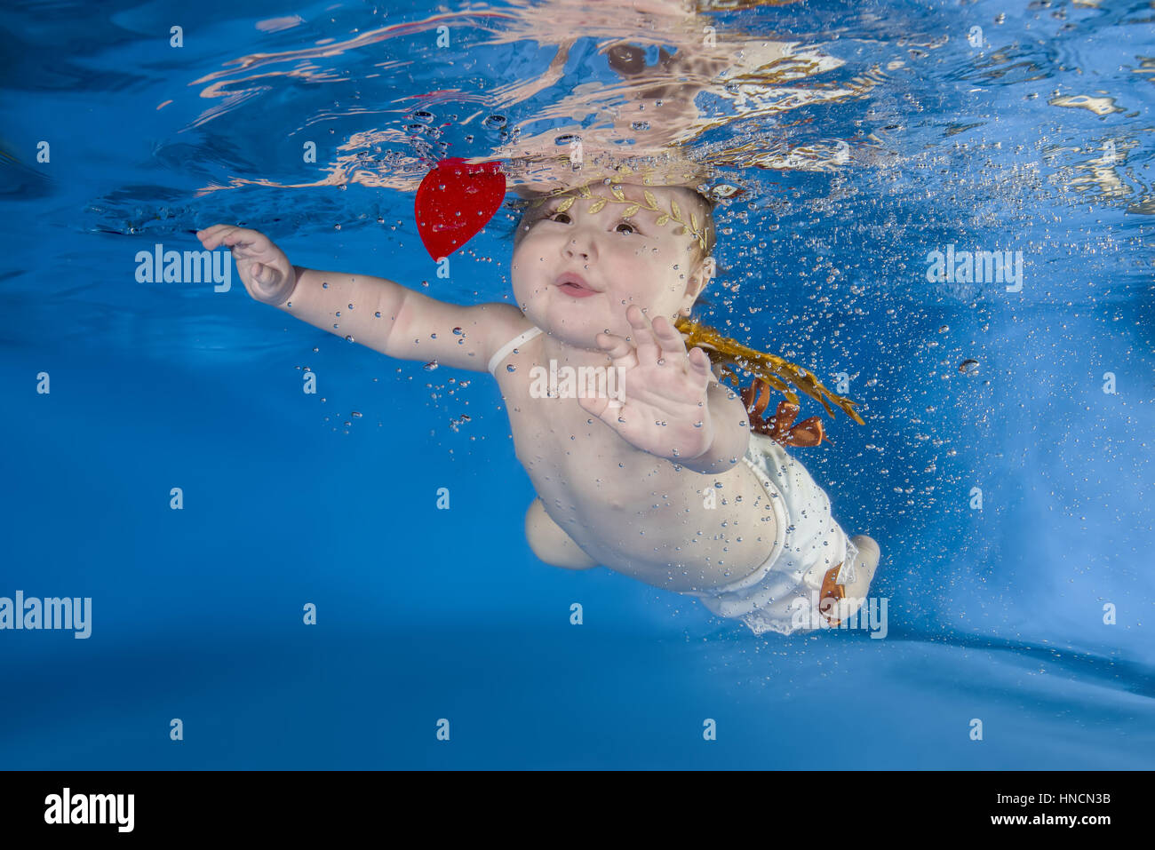 Little angel in blue dress hi-res stock photography and images - Alamy