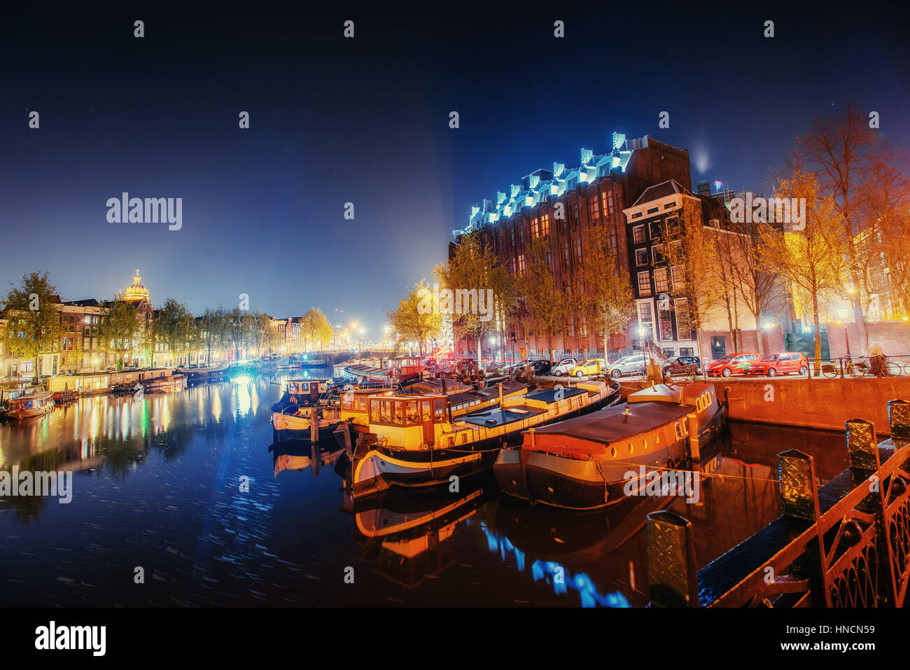 Beautiful night in Amsterdam. illumination of buildings an Stock Photo ...