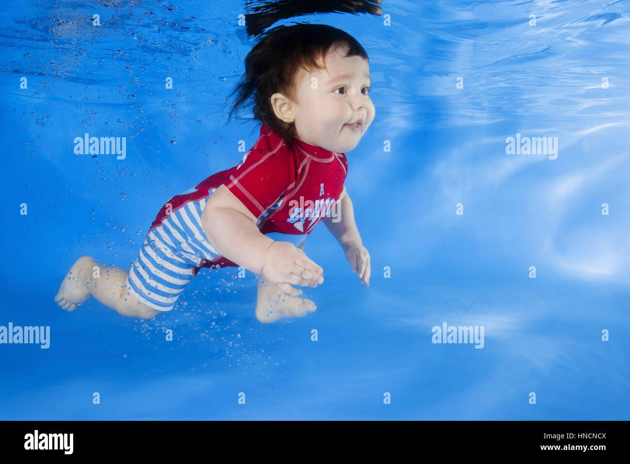 Male model in swimming pool hi-res stock photography and images - Alamy