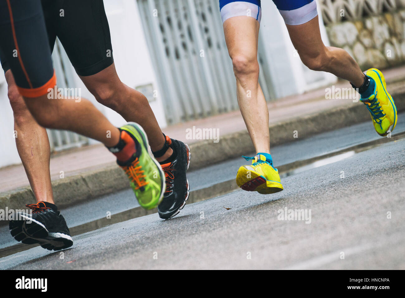 Group of marathon runners on the street Stock Photo - Alamy