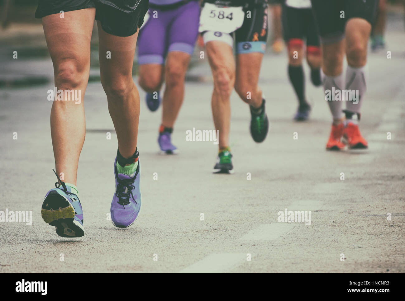Group of marathon runners on the street Stock Photo - Alamy