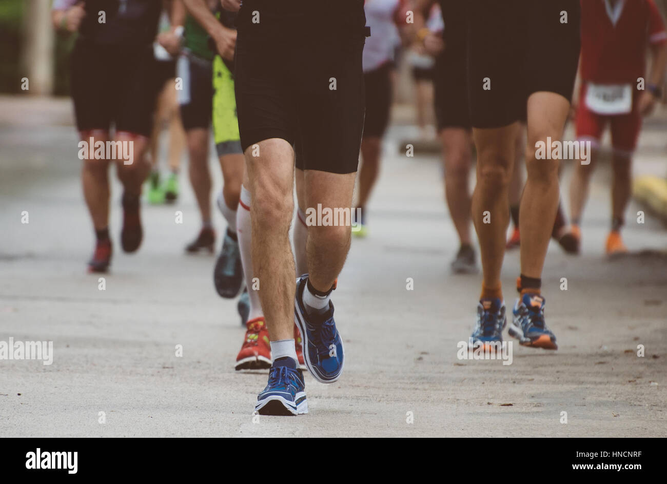 Group of marathon runners on the street Stock Photo - Alamy