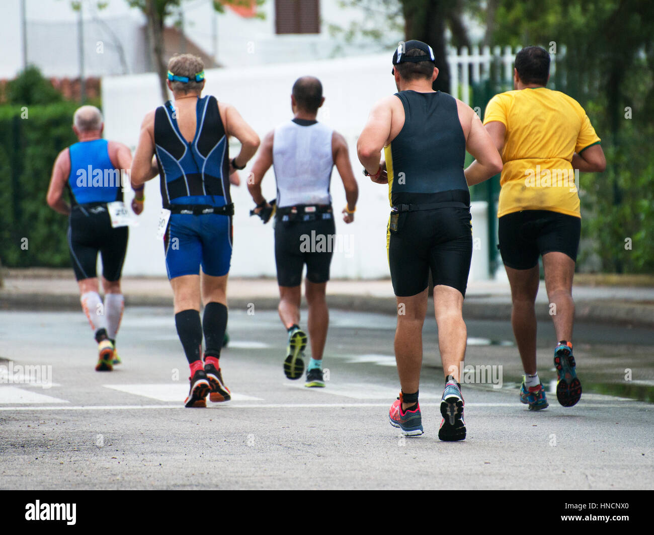 Group of marathon runners on the street Stock Photo - Alamy