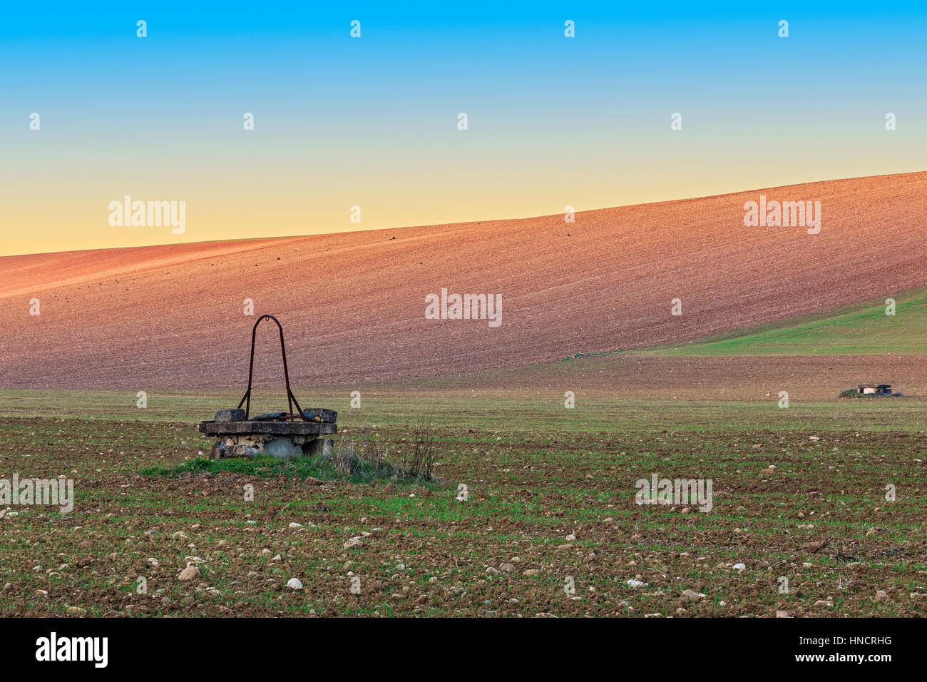 antique well in field Stock Photo - Alamy