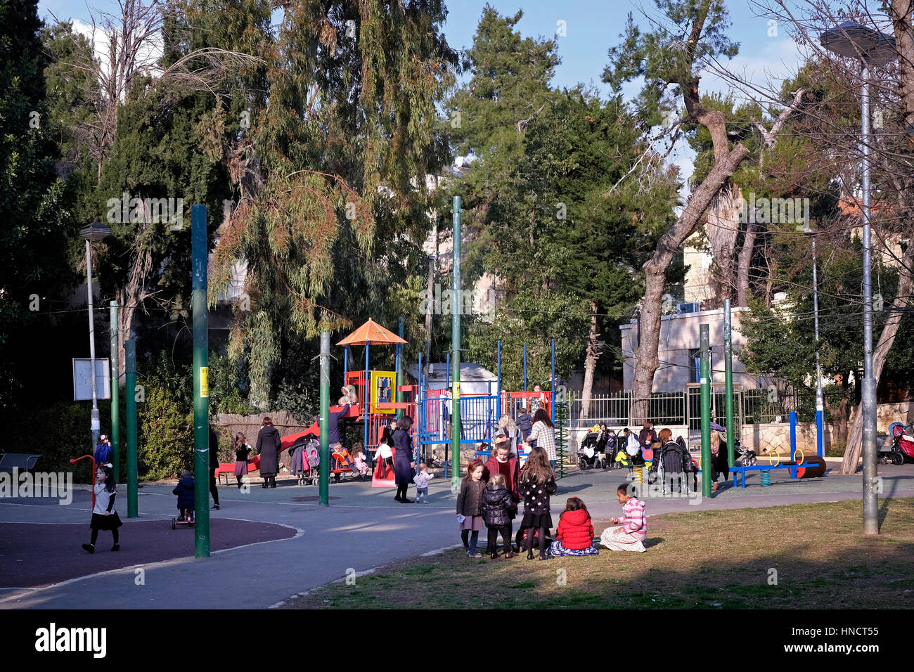 Religious Jewish children playing in a public garden in Rehavia also ...