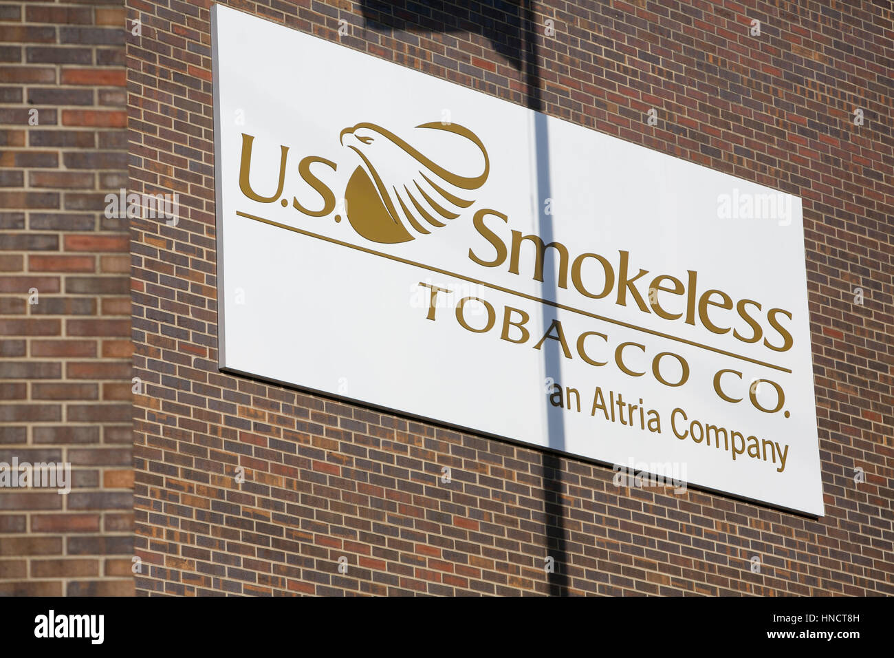 A logo sign outside of a facility occupied by the U.S. Smokeless ...
