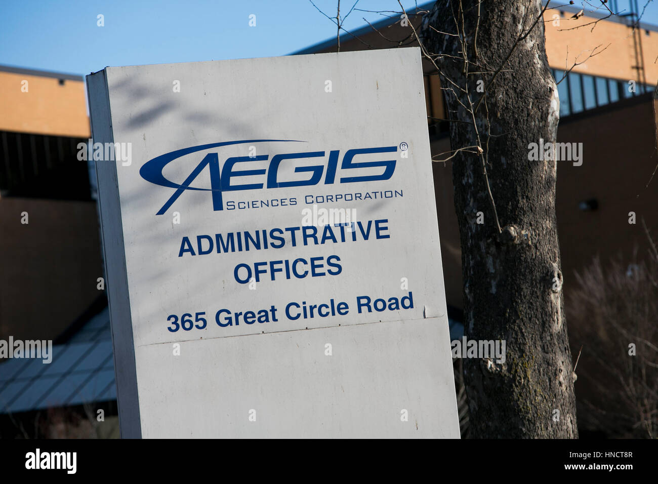 A logo sign outside of the headquarters of the Aegis Sciences ...