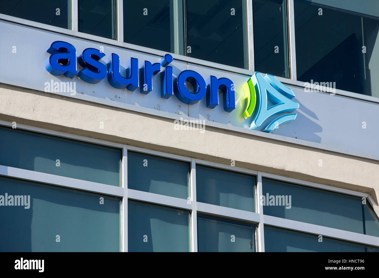 A logo sign outside of a facility occupied by Asurion in Nashville ...