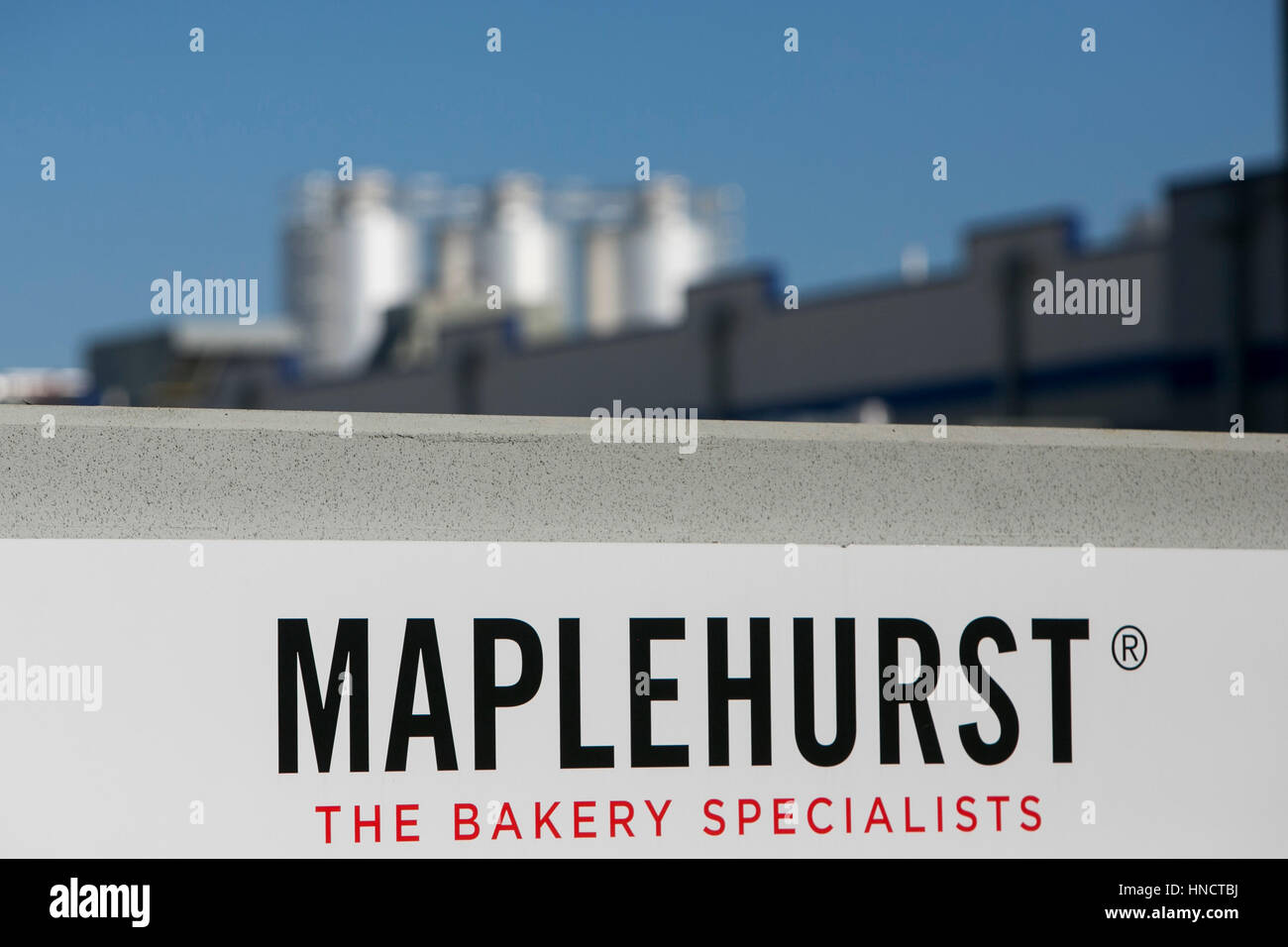 A logo sign outside of a facility occupied by Maplehurst Bakeries in ...