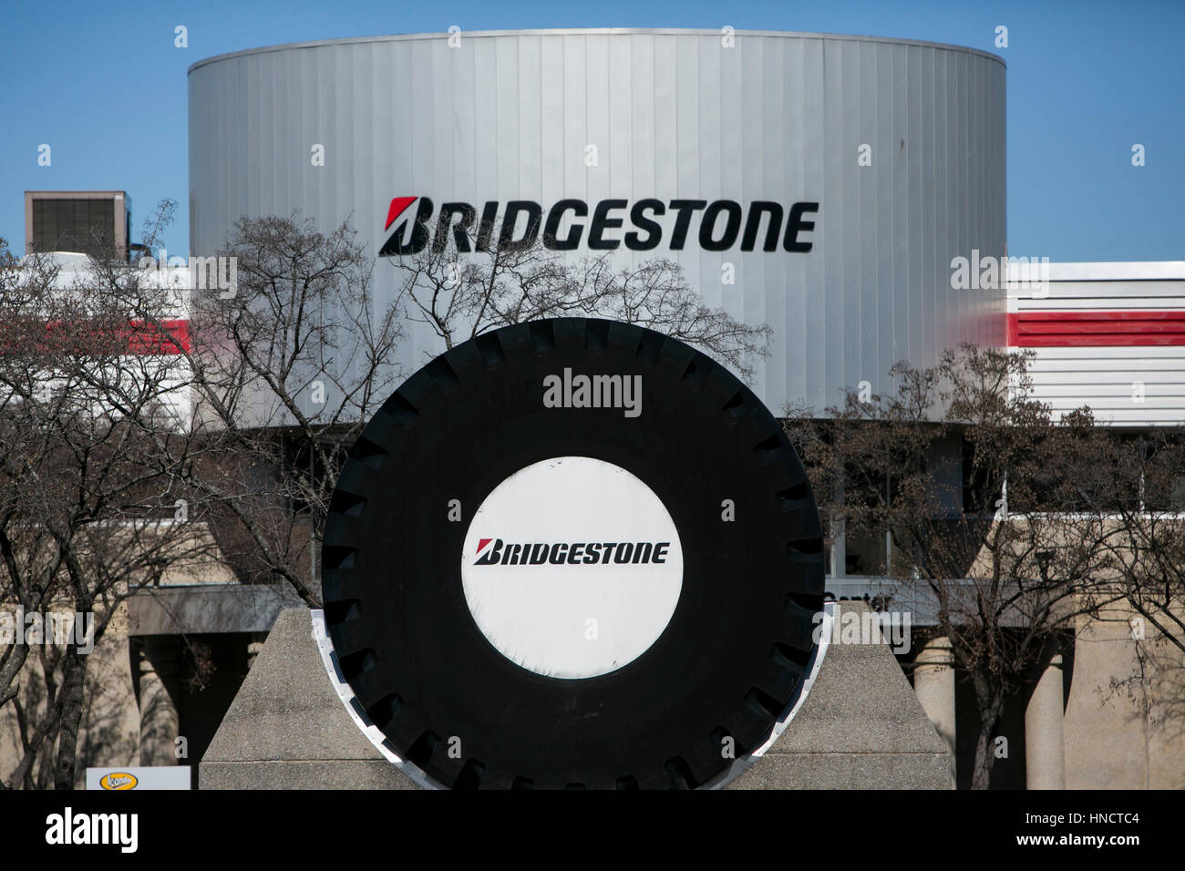 A logo sign outside of a facility occupied by the Bridgestone ...